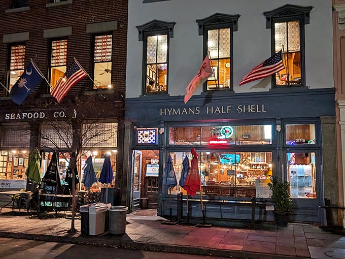 The iconic blue and white façade of Hyman's glows like a beacon for hungry souls wandering Charleston's historic streets at dusk.