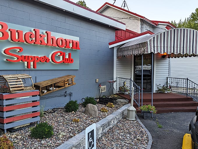 The iconic red lettering against gray concrete promises what every Wisconsinite knows: supper club magic awaits inside.