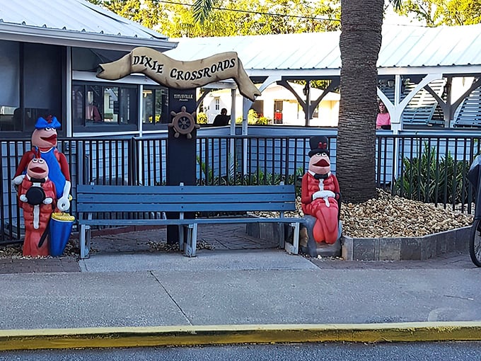 Sailor-themed whimsy greets you at the entrance. Those bench-sitting seafarers aren't just decorative—they're silently judging your appetite for rock shrimp.