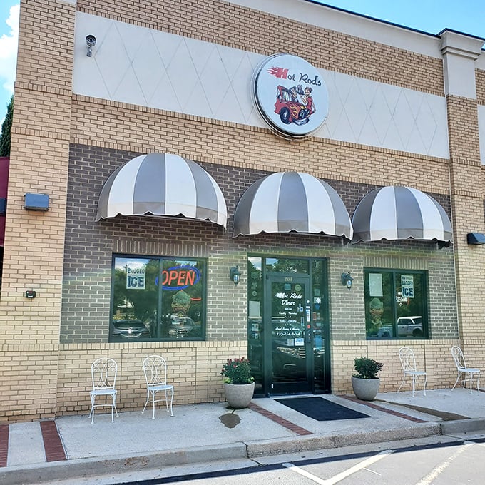 Hot Rod's brick exterior with its classic striped awnings isn't trying to be fancy—it's too busy being exactly what a great American diner should be.
