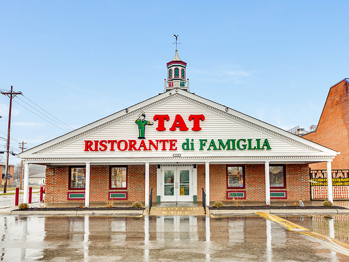 The iconic white facade of TAT Ristorante Di Famiglia stands proudly in Columbus, its red and green signage a beacon for Italian food lovers since 1929.