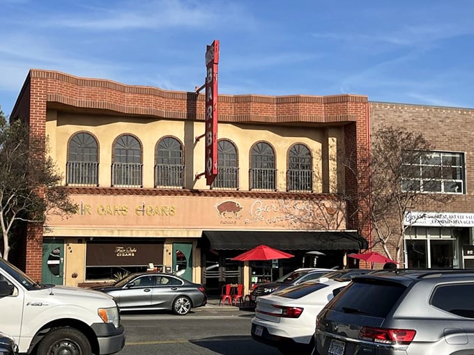 The brick façade of Gus's BBQ stands proudly on Fair Oaks Avenue, its vintage sign a beacon to barbecue pilgrims seeking smoky salvation in South Pasadena. 