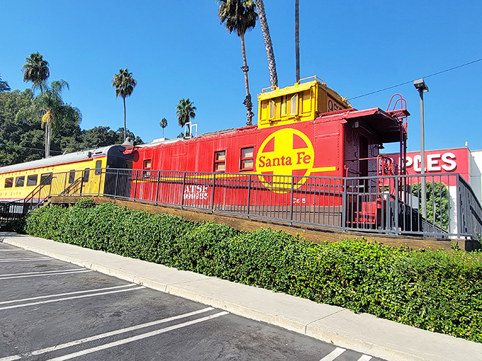 The iconic yellow and red train cars of Carney's stand out against the California sky like a delicious mirage on Sunset Boulevard.