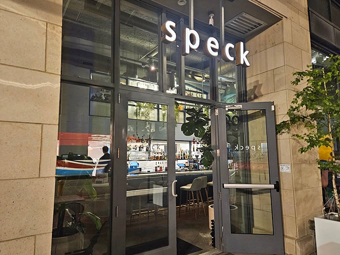The sleek exterior of Speck beckons like a culinary lighthouse in downtown Columbus, promising Italian delights behind those glass doors.