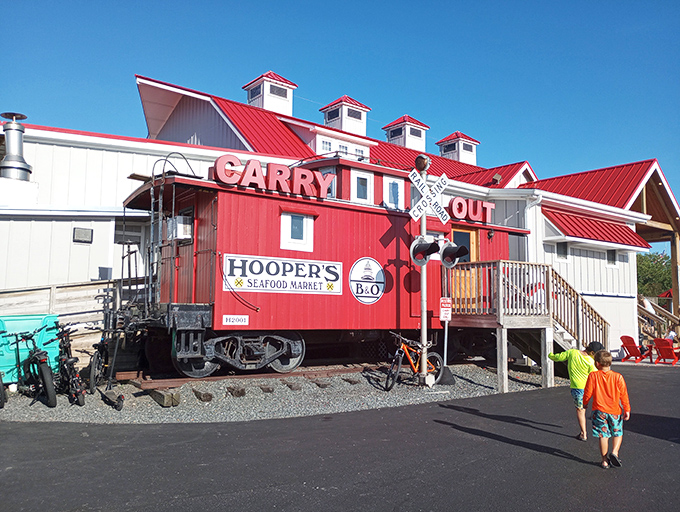 The iconic red caboose at Hooper's isn't just for show—it's a fully functioning carry-out market. Railroad history meets seafood heaven in one perfect Ocean City landmark.
