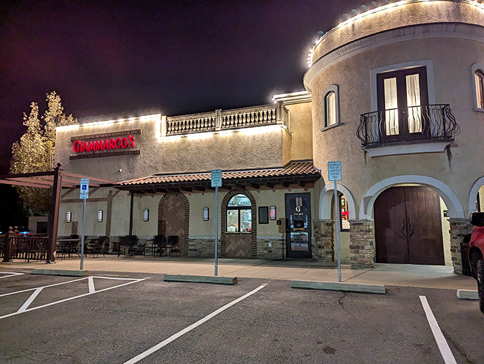The Mediterranean-inspired exterior of Giammarco's glows invitingly at night, its stucco walls and stone accents promising Italian comfort within.