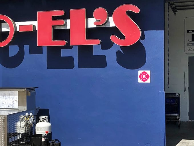 That pink-on-blue sign practically winks at you from the street – Florida's most colorful kosher secret.