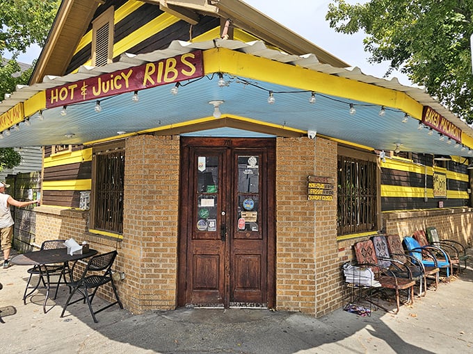The purple and yellow stripes aren't just eye-catching—they're a barbecue bat signal calling hungry mortals to this Bywater sanctuary of smoke.
