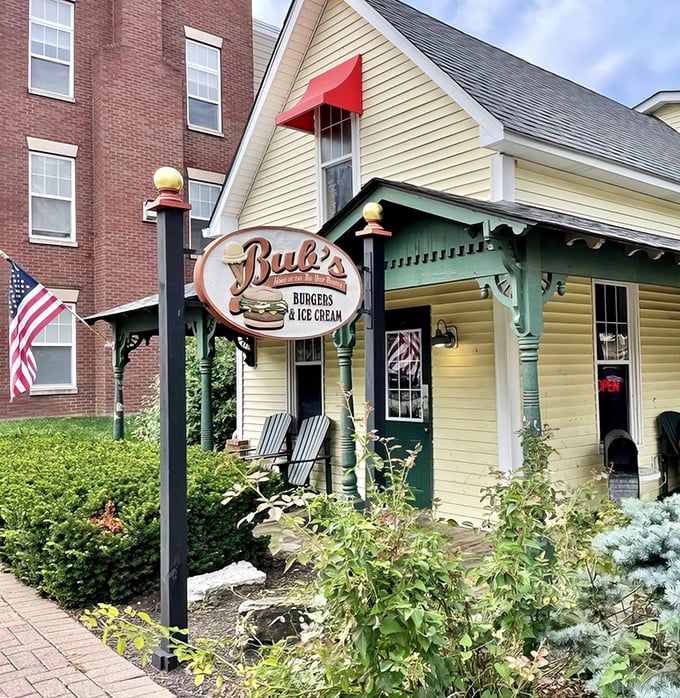 The charming yellow house with green awnings isn't just another pretty facade—it's burger paradise hiding in plain sight in Carmel.