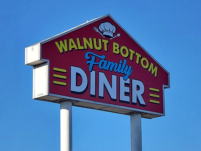 That burgundy sign with the cheerful chef's hat isn't just advertising – it's practically sending smoke signals to hungry travelers everywhere.