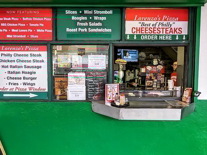 The green storefront of Lorenzo's Pizza beckons like a culinary lighthouse, promising cheesesteaks that'll make your taste buds stand at attention.