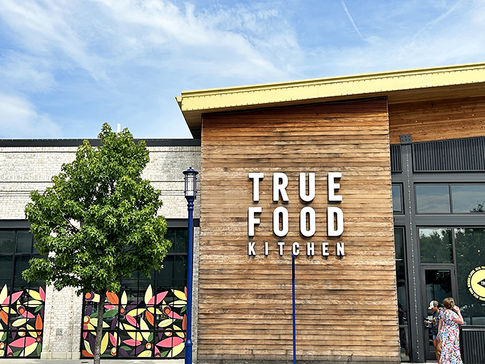 True Food Kitchen's wooden façade brings warmth to modern dining. The sleek signage promises what's inside: honest food that doesn't sacrifice flavor for health.