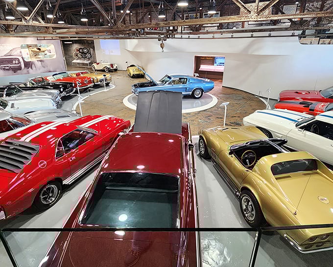 A candy store for grown-ups where Detroit's finest creations rest on circular platforms, each vehicle telling its own American story through chrome and steel.