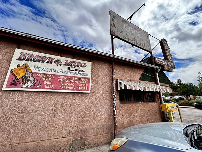 The unassuming pink stucco exterior of Brown Mug Cafe stands like a culinary mirage in Winslow, promising Mexican-American delights beneath dramatic Arizona skies.