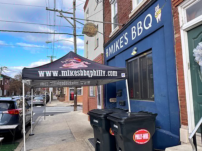 The blue storefront of Mike's BBQ stands like a beacon of smoky hope on East Passyunk Avenue, promising carnivorous delights within.