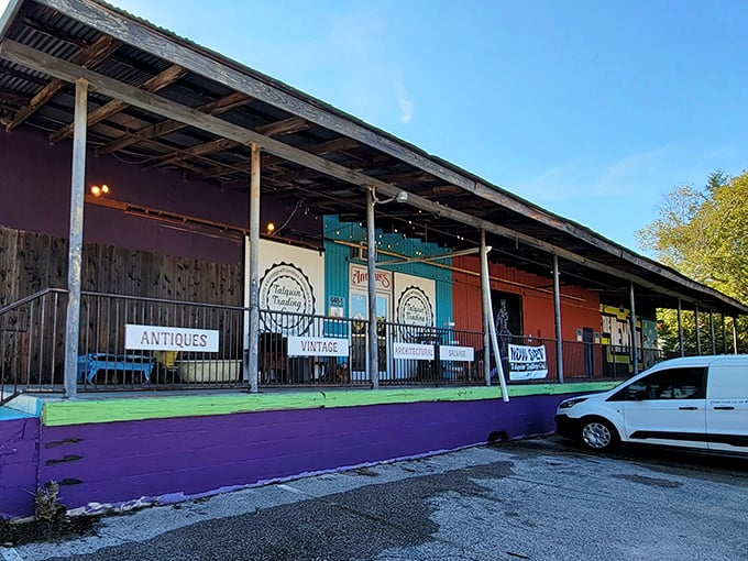 The colorful exterior of Talquin Trading Co. beckons with its vibrant purple foundation and rustic covered porch—Florida's answer to treasure hunting without a metal detector.
