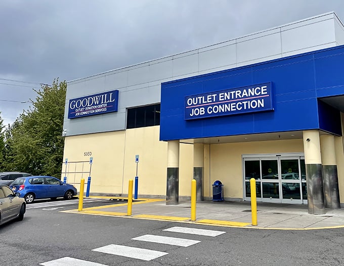 The unassuming blue and cream exterior of Goodwill's Portland outlet store—where treasure hunting champions are made daily and bargain legends are born.