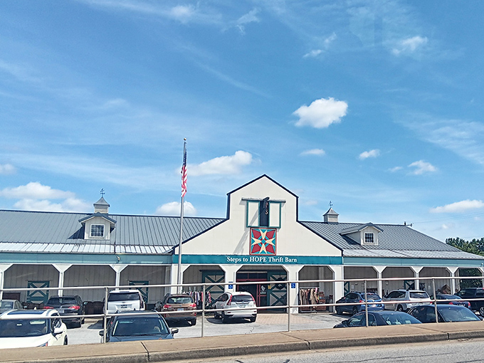 The iconic barn-style exterior of Steps to Hope stands proudly against Carolina blue skies, its quilt square logo beckoning treasure hunters from miles around.