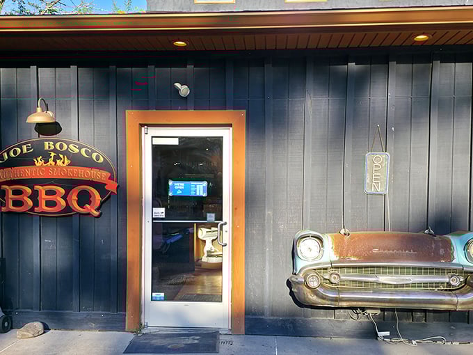 The navy blue exterior with that vintage car front mounted on the wall isn't just decoration—it's a promise that what awaits inside is classic Americana at its most delicious.
