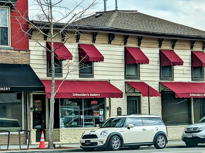 Those red awnings aren't just for show—they're nature's way of saying "Slow down, sugar seeker, paradise awaits inside these humble walls."