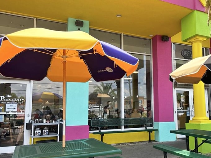 The Pancakery's rainbow-bright exterior isn't just eye-catching—it's practically screaming "Wake up, sunshine! Breakfast magic happens here!"