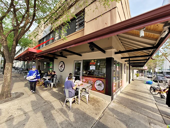Outdoor seating where pizza dreams come true – watch Tampa's urban life unfold while that New York-style slice cools just enough to devour.