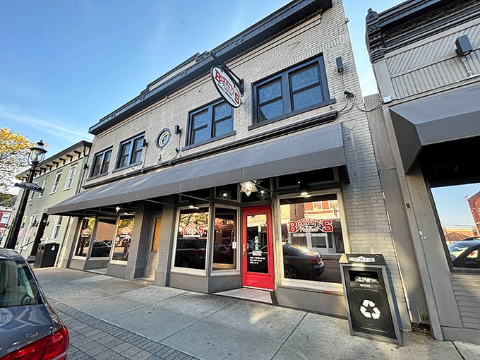 The inviting storefront of Bennett's Publical beckons with its bold red signage, star-shaped pendant lights, and lush greenery. A culinary oasis in downtown Miamisburg.