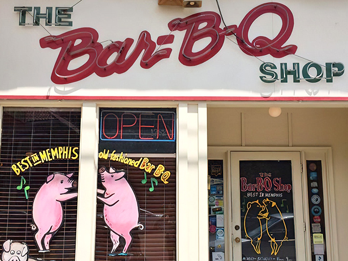 Those dancing pigs aren't just cute – they're celebrating because they know you're about to experience barbecue nirvana at The Bar-B-Q Shop.