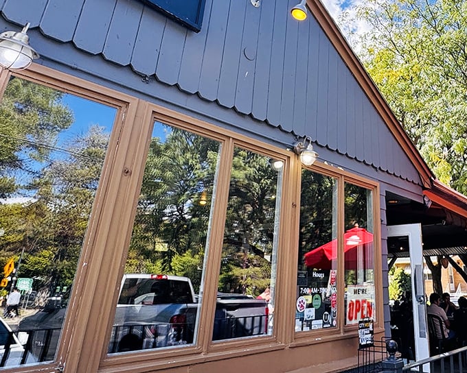 The blue exterior of The Park Café stands like a humble guardian of breakfast dreams, promising culinary magic within its unassuming walls.