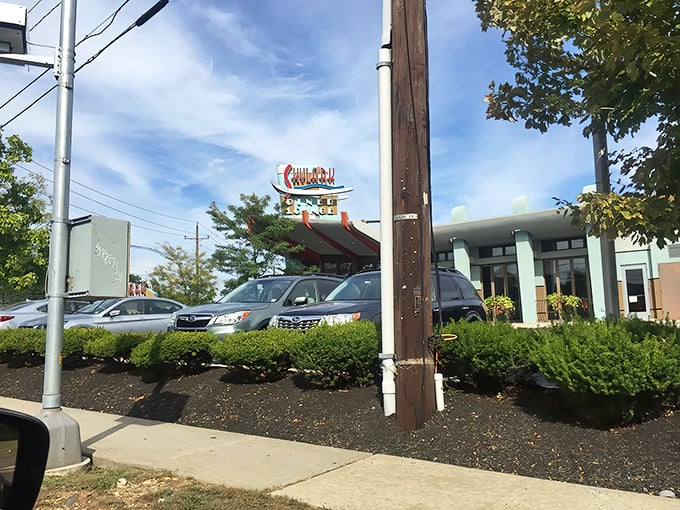 The iconic Skylark sign beckons hungry travelers along Route 1 in Edison – a retro-modern beacon promising diner delights beyond the ordinary.