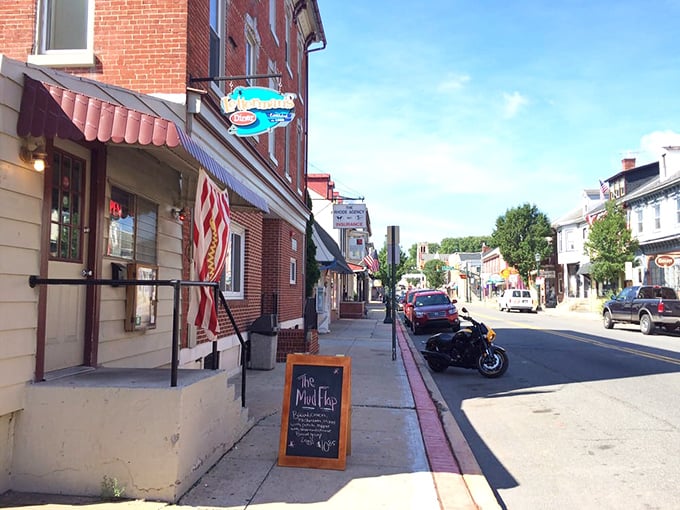 Main Street Americana at its finest. That vintage neon sign isn't retro by design—it's retro because it's been there since before retro was cool.