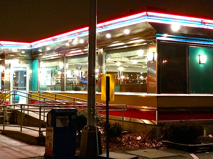 The neon glow of The American Diner beckons like a lighthouse for hungry souls, promising refuge from culinary mediocrity and a warm embrace of nostalgic comfort.
