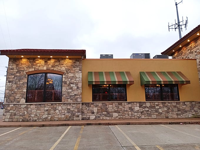 Stone and stucco with those classic red and green striped awnings – it's like Italy decided to set up shop in Parma, Ohio.