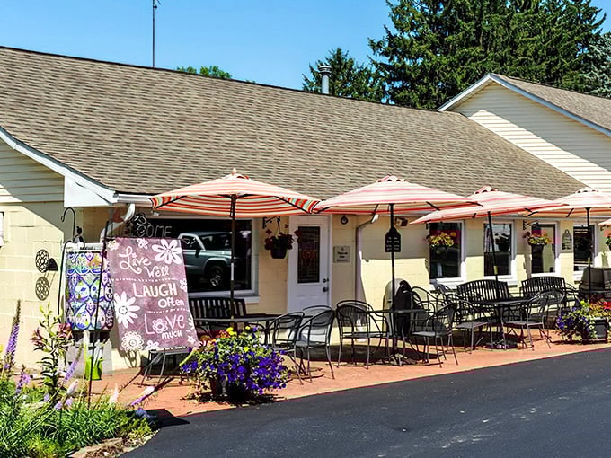 Clay's Café welcomes you with colorful umbrellas, hanging flower baskets, and a patio that practically begs you to sit and stay awhile.