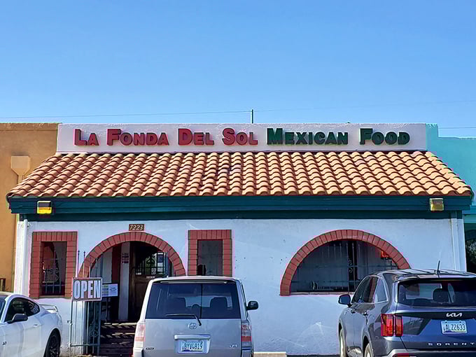 The unassuming exterior of La Fonda Del Sol beckons with its classic Spanish-style roof and distinctive red-trimmed arches—proof that culinary treasures often hide in plain sight.