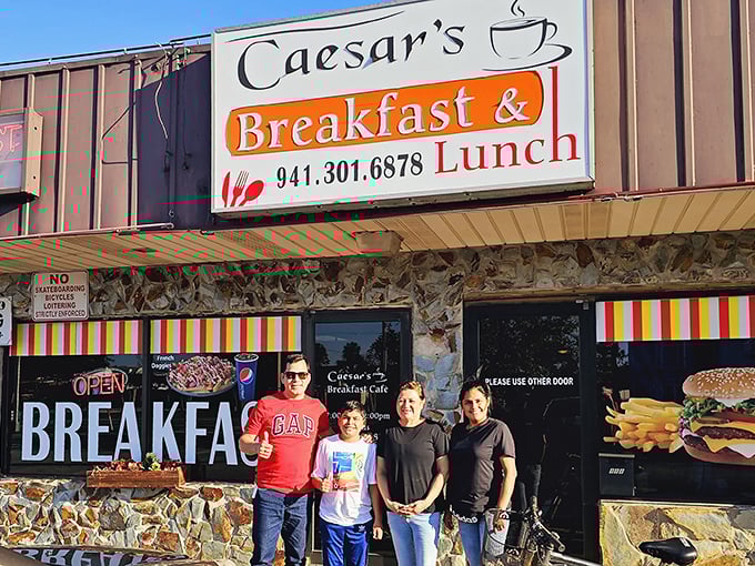 Happy diners pose outside Caesar's, their smiles saying what words can't – they've found breakfast nirvana in Bradenton.