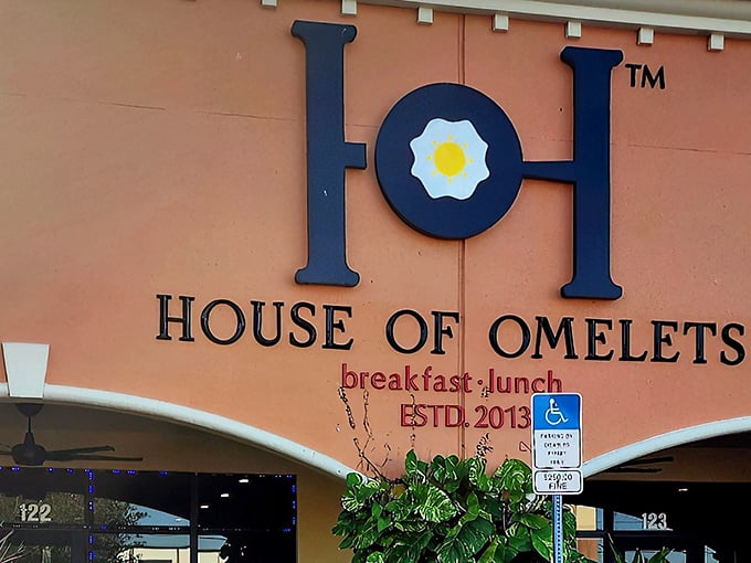 That coral-colored exterior promises serious breakfast business – and those tropical plants whisper "Florida magic awaits."