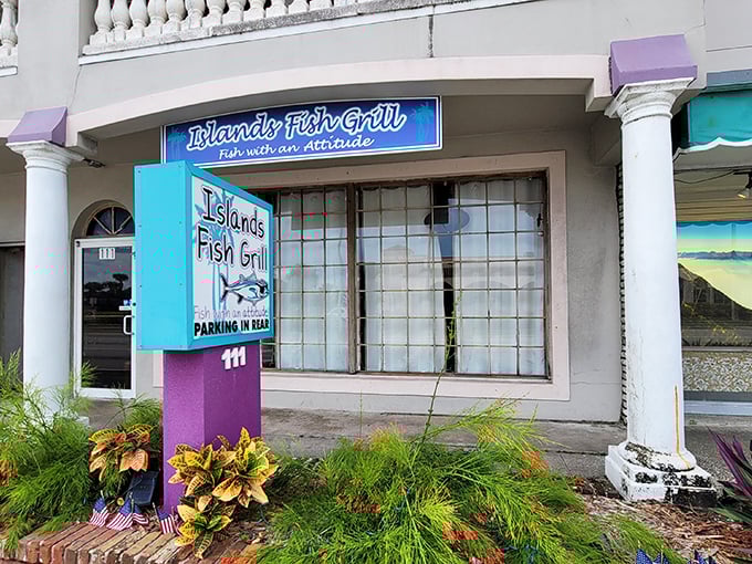 A splash of turquoise and purple announces this hidden gem, where the unassuming exterior belies the culinary treasures waiting inside.