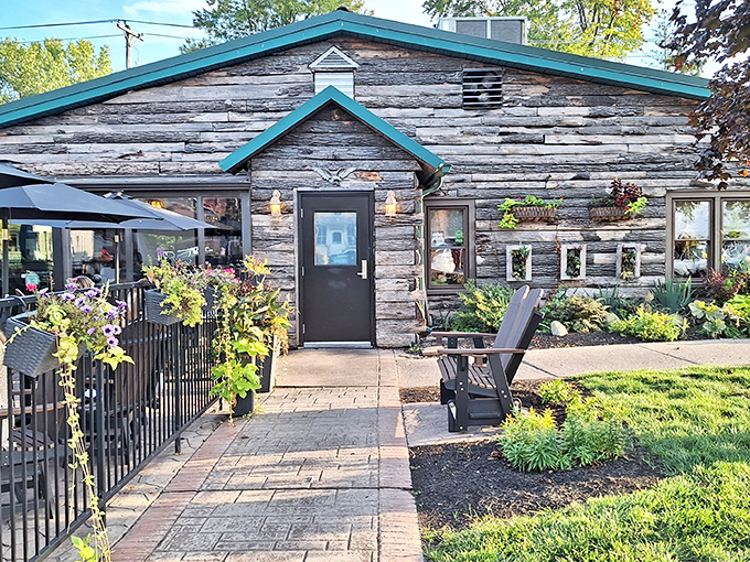 The rustic log cabin exterior of The Whitehouse Inn feels like discovering a presidential retreat where the only executive orders are for prime rib.