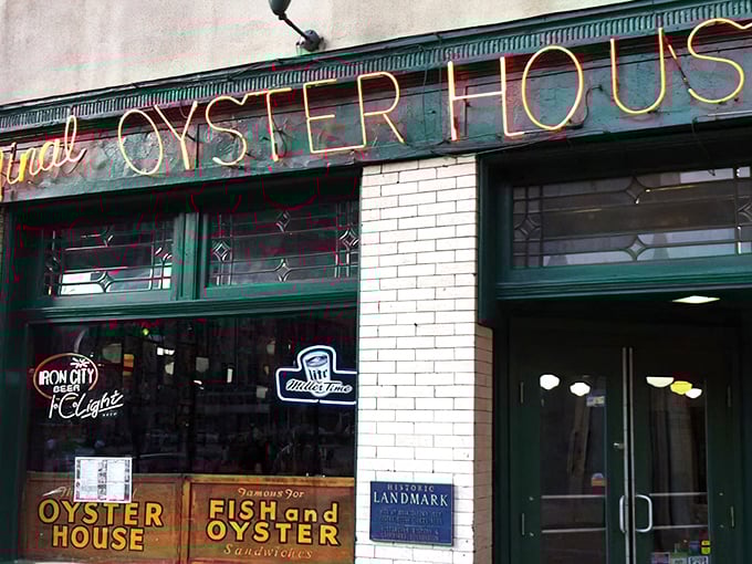 The red neon glow beckons like a lighthouse for landlocked seafood lovers seeking oceanic treasures.