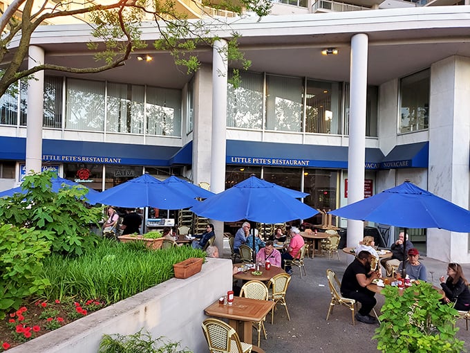 Little Pete’s welcoming patio, shaded by bright blue umbrellas, invites Philadelphians to gather and enjoy timeless comfort food in a lively setting.”