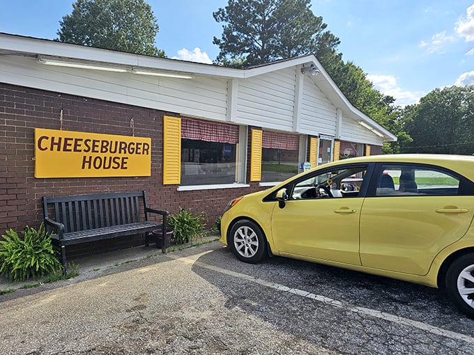 The unassuming exterior of Johnny's Cheeseburger House proves once again that culinary treasures often hide behind modest facades. Yellow shutters hint at the golden delights within.