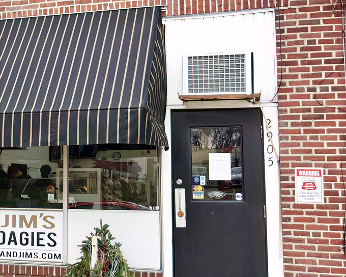 The unassuming storefront that houses sandwich greatness. Classic striped awning, brick facade, and zero pretension—just the way a legendary hoagie shop should be.