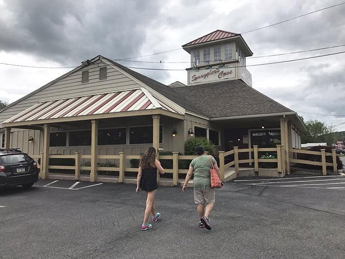 The lighthouse-inspired cupola atop Smuggler's Cove stands as a beacon for hungry travelers. Maritime charm meets mountain hospitality in Tannersville.