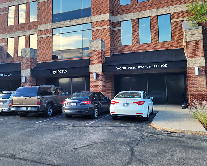 Don't judge this culinary book by its office-park cover – behind these doors awaits a wood-fired wonderland of flavor.