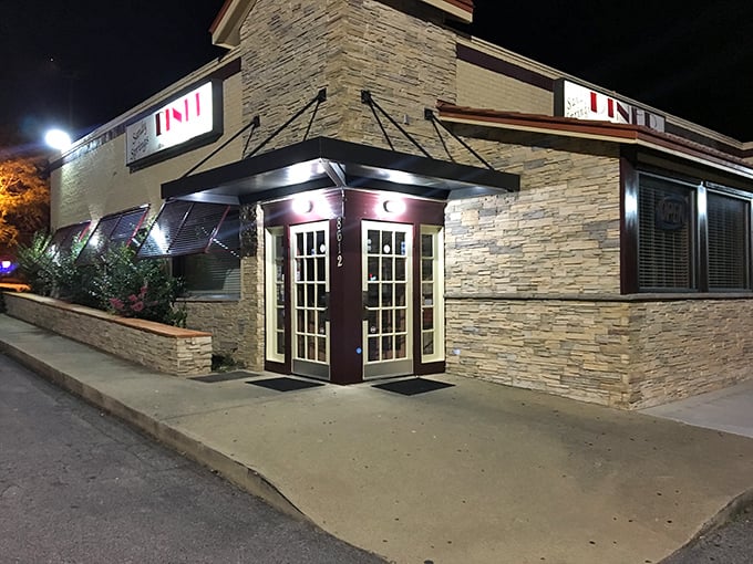 The stone facade of Sandy Springs Diner glows with warm invitation at night, like a culinary lighthouse guiding hungry travelers home.