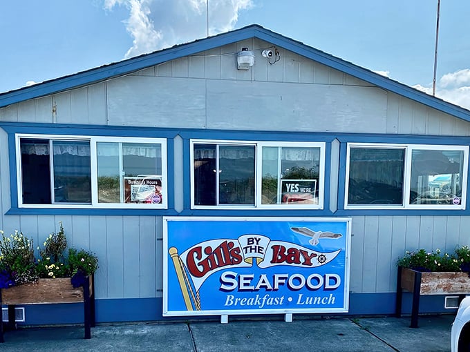 Bright blue trim frames this coastal hideaway like a picture postcard, complete with flower boxes that add a touch of homey charm to this seafood sanctuary.