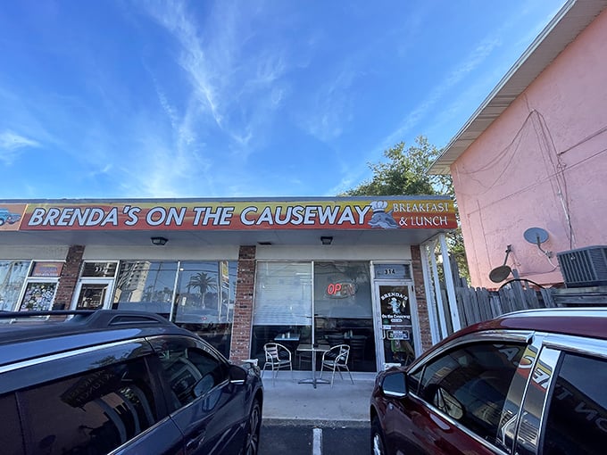 Florida sunshine illuminates this humble breakfast haven. The pink building and classic signage promise authentic diner delights without pretension.