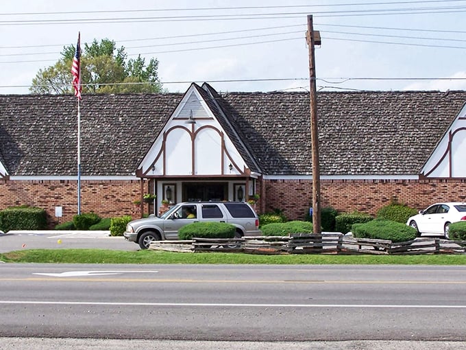The distinctive peaked roofline and brick facade whisper "serious barbecue lives here" to every passing car on the highway.
