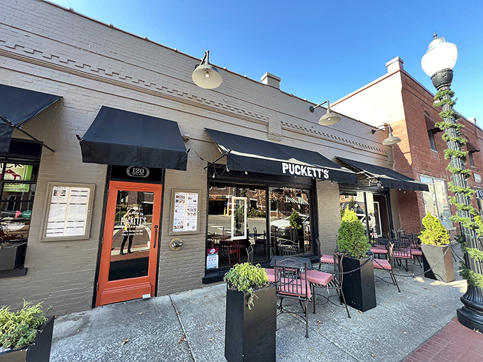 Historic charm meets Southern hospitality on Franklin's Main Street, where Puckett's brick façade promises comfort food that'll make you contemplate a change of address.